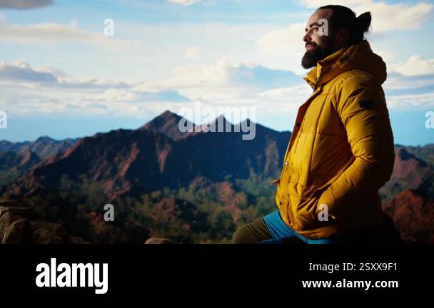 Hiker embraces the challenge of trekking through the wilderness, enjoys ...
