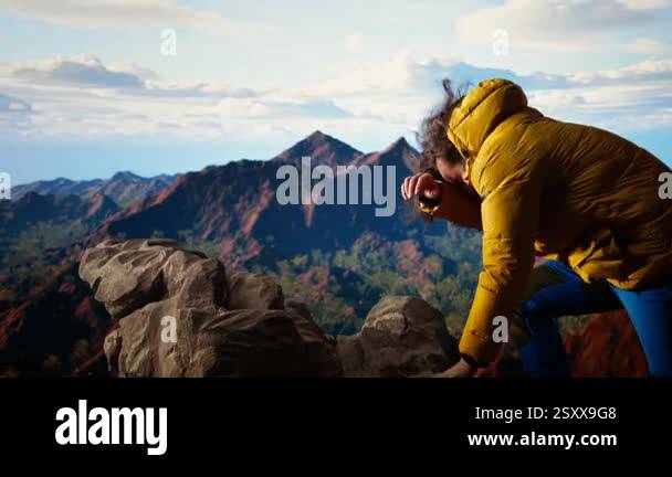 Hiker battling strong winds and cold weather tumbles over a cliff on ...