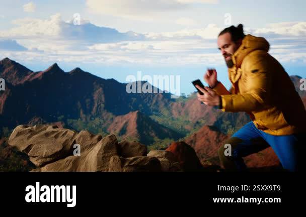 Reckless trekker risking his life focusing on his phone and falling ...
