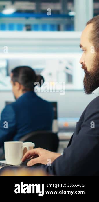 Vertical video Photovoltaics factory engineer looking over paperwork ...