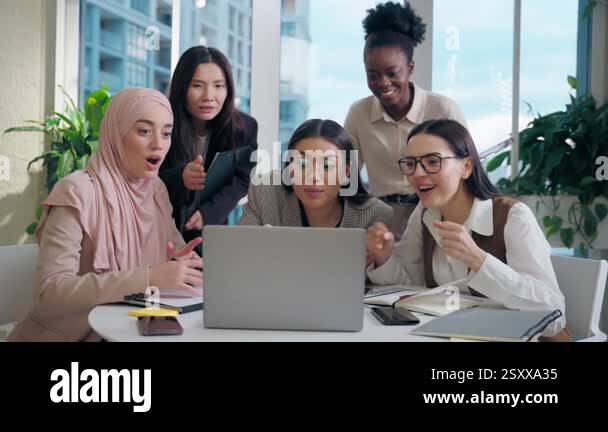 Excited shocked multiethnic women females businesswomen team colleagues ...