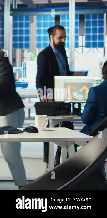 Vertical video Photovoltaics factory engineer drinking coffee adjusting system parameters ...