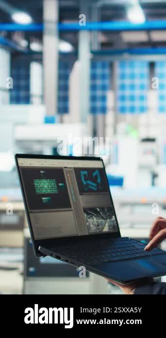 Vertical video Photovoltaics factory worker analyzing data, reviewing system health metrics with ...