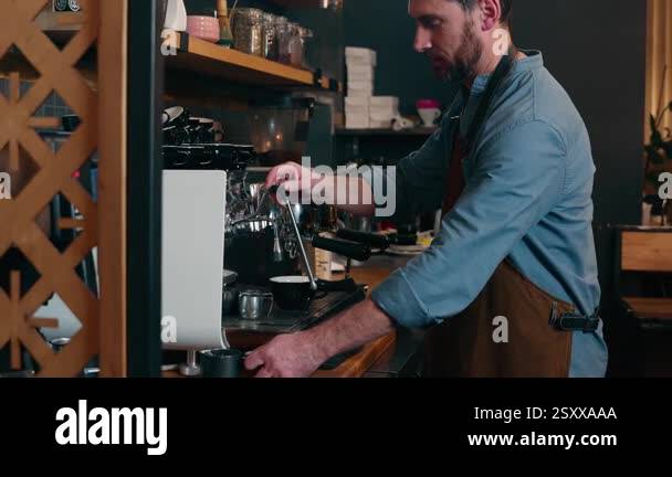 Caucasian waiter staff man guy employee making drink latte in cafe ...