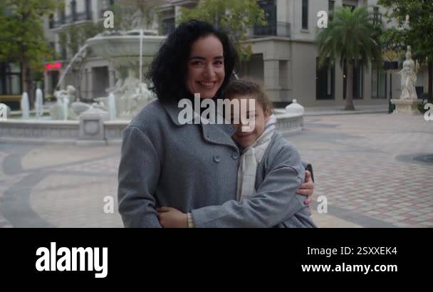 Mother and daughter showing thumbs up class. Portrait of a mother and ...