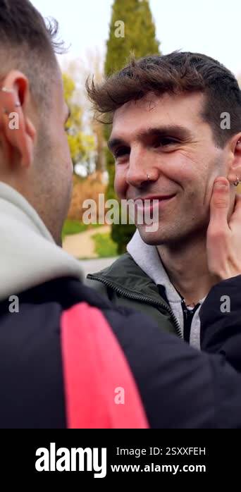 Romantic moments between a young caucasian gay couple, exchanging ...