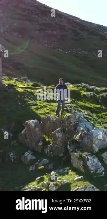 Picturesque journey of a hiker exploring the rocky terrain and scenic ...