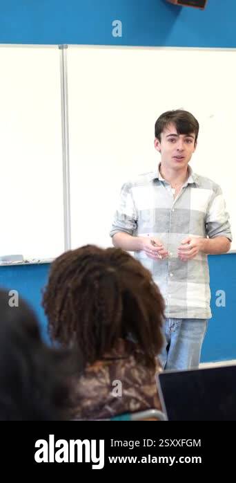 Young male student sharing academic knowledge while explaining lesson ...