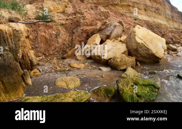 Large yellow sand clay stones sandstone boulders rocks on the sandy ...