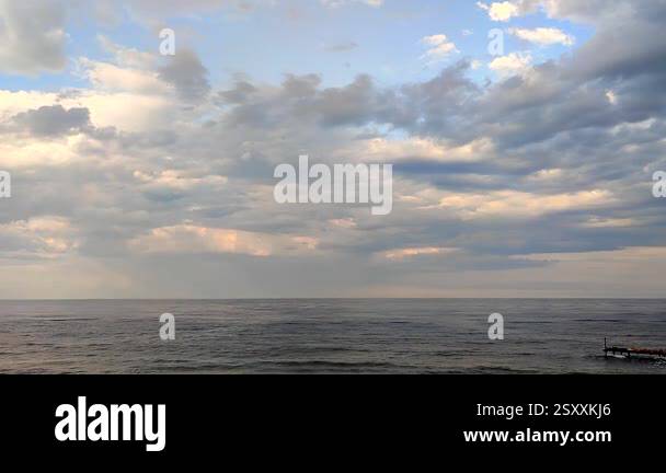 Rain in the sea. View of rain, rain clouds, sea and sea waves with ...