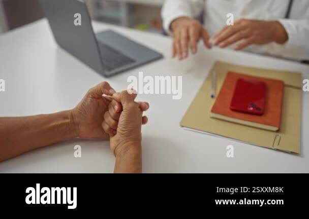 Doctor and patient interaction in a clinical setting featuring hands on ...