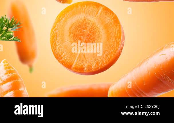 carrot slices on a beige background Stock Video Footage - Alamy