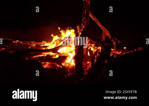 Vibrant bonfire burning intensely in dark desert landscape of marsa ...