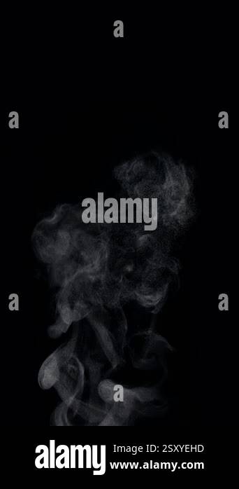 White natural rising steam from food or hot drink isolated on a black ...