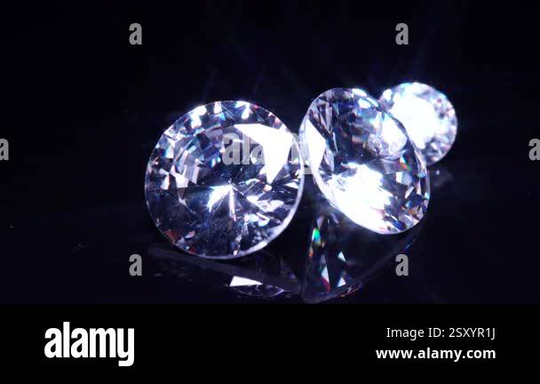Diamonds selective focus on black reflective background. Polished gem ...