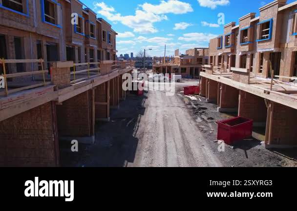 Aerial inspection view over new townhouse constructions development ...