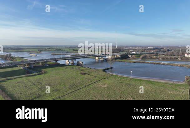 Infrastructure highway bridge over the Lek river, water way and road ...