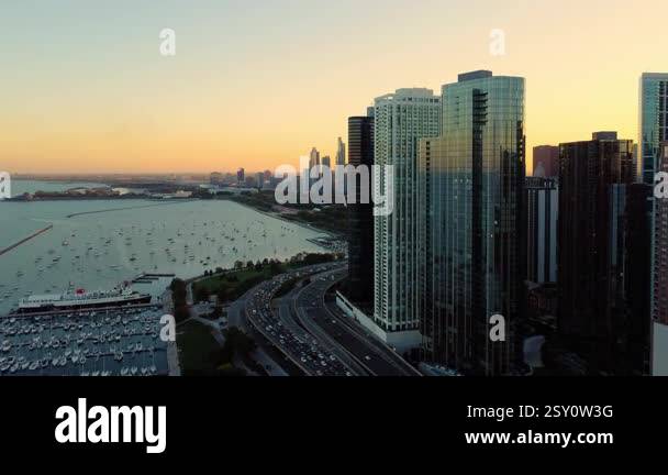 Chicago skyline with lakefront and boats at sunset. Aerial view of ...