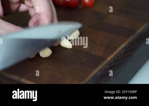 Learn the best techniques for cutting garlic with a knife. From peeling to mincing, this guide ...