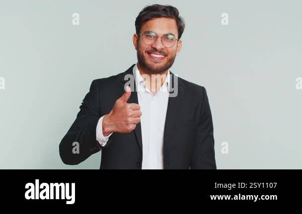 Like. Indian businessman raises thumbs up agrees with something or ...