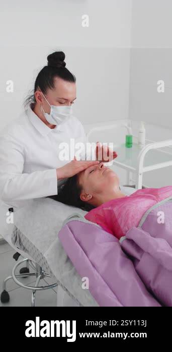 Doctor Making Woman Relaxing Spa Face Massage With Hands During 9700