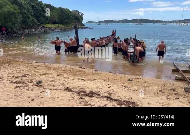 WAITANGI, NZL - FEB 06 2025:Maori warriors arriving in war canoes to ...