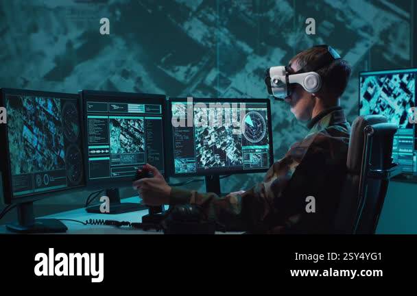 Dramatic scene of a soldier in a dimly lit military control room ...