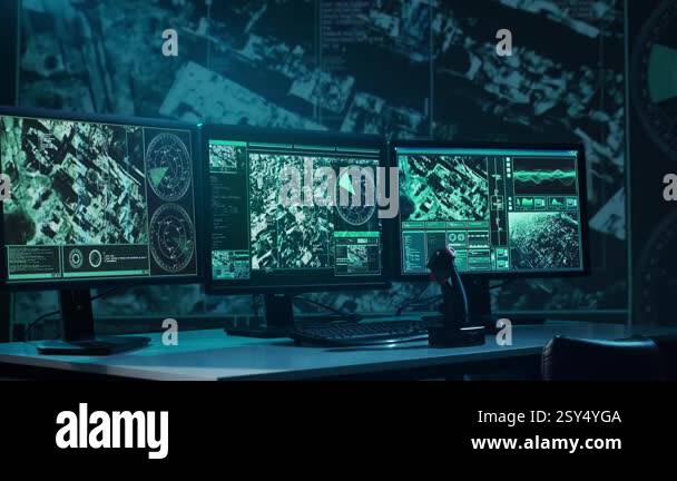 Dramatic scene of a soldier in a dimly lit military control room ...