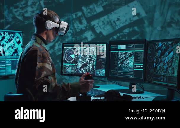 Dramatic scene of a soldier in a dimly lit military control room ...
