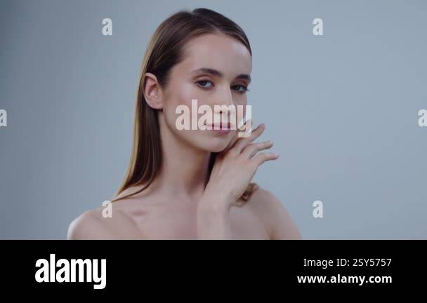 A serene portrait of a young woman highlighting her natural beauty ...
