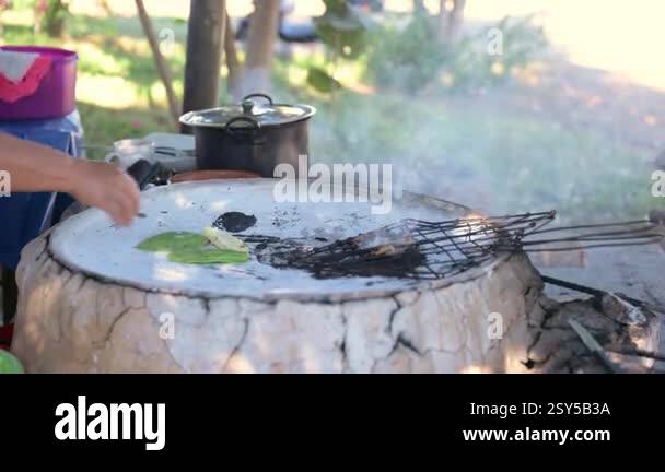 Chef preparing authentic mexican street food on traditional comal ...
