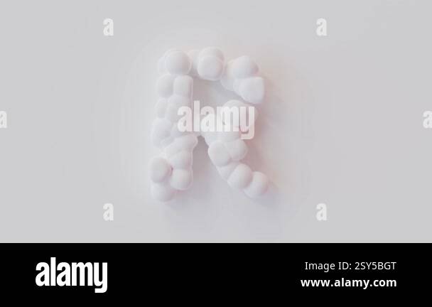 Spheres enlarged and crowded together to form letter font R. and Alpha ...