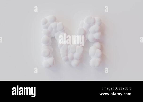 Spheres enlarged and crowded together to form letter font M. and Alpha ...