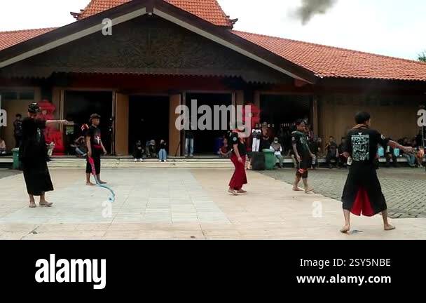 Asian Indonesian male dancers spit fire during a bull dance performance ...