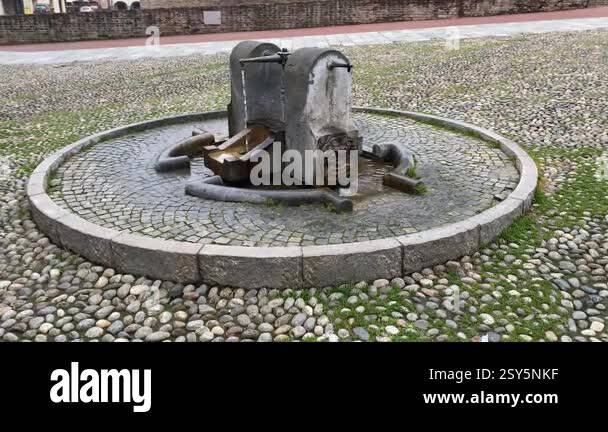 Fontanellato, Parma, Italy January 8th 2025 Stone fountain featuring ...