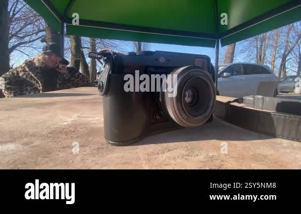 Mantova, Italy February 9th 2025 Black mirrorless camera with leather ...