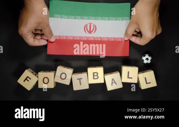 Iran flag with football title. football concept Stock Video Footage - Alamy