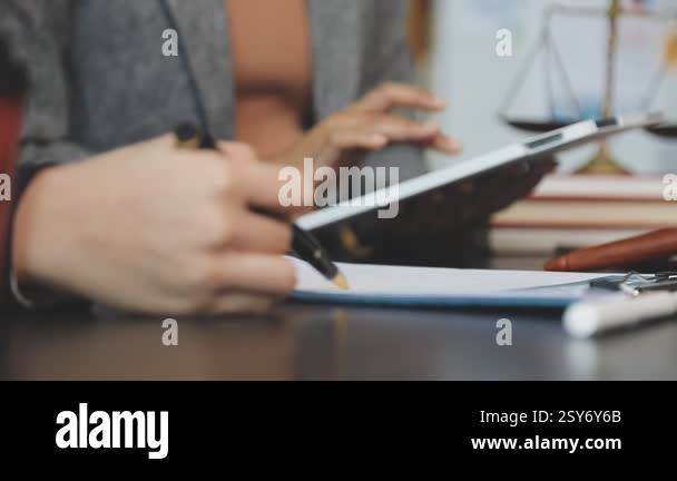 male hand holding pen and judge gavel Stock Video Footage - Alamy