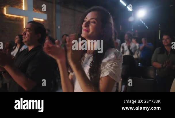 Clapping and smiling woman worshipping in church, Christian faith ...