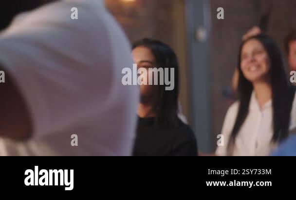 Diverse congregation holding offering envelopes during church worship ...