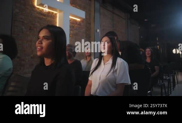 Clapping hands during worship in a Christian church, diverse people ...