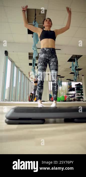 A fit woman performs various exercises, showcasing strength and ...