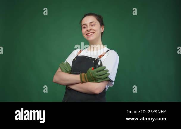 Running of own business. Woman florist gardener farm worker with pruner ...