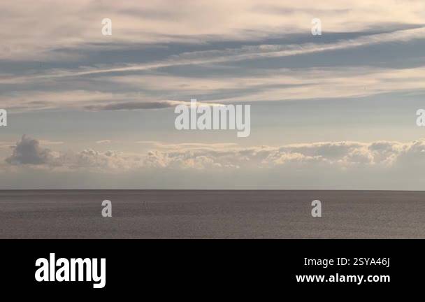 Imagine a serene ocean scene with gentle waves on soft sand under a ...