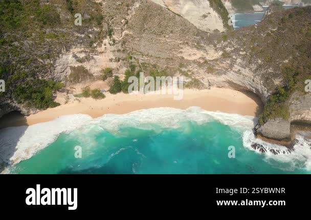 Aerial view of turquoise waves at Kelingking Beach on Nusa Penida ...