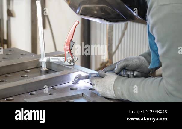 Professional welder joining metal parts Stock Videos & Footage - HD and ...