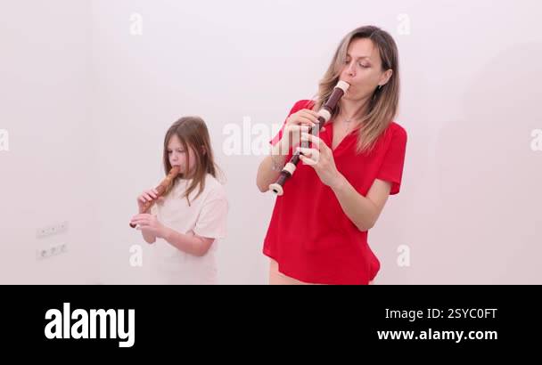 Music teacher and girl play melody together. Teacher and student ...