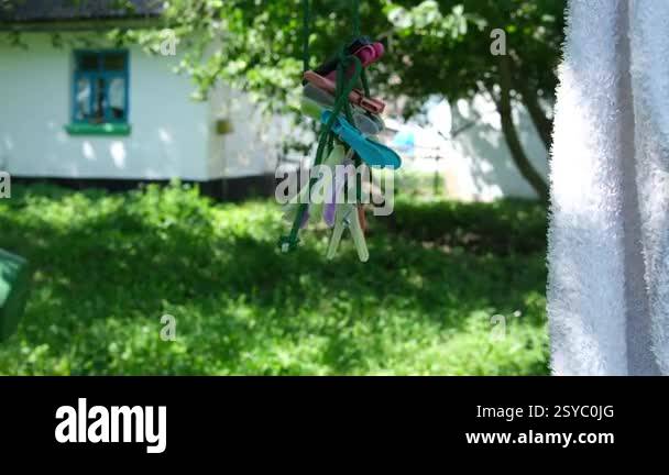 girl washes clothes in a washing machine and hangs them outside Laundry ...