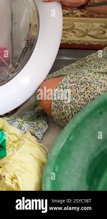 girl washes clothes in a washing machine and hangs them outside Laundry ...