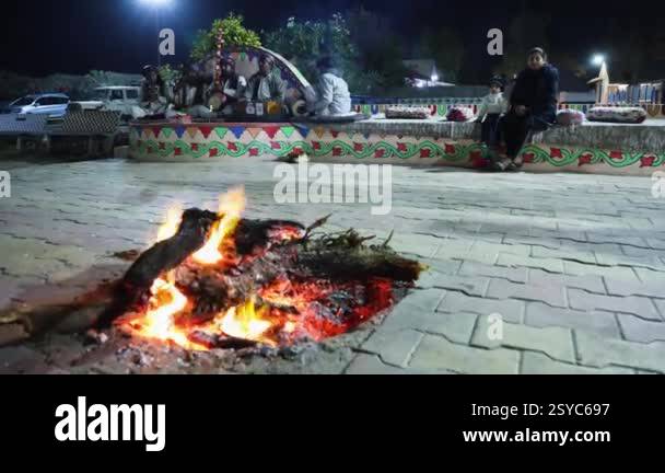 group of local artists singing traditional folk music with campfire at ...